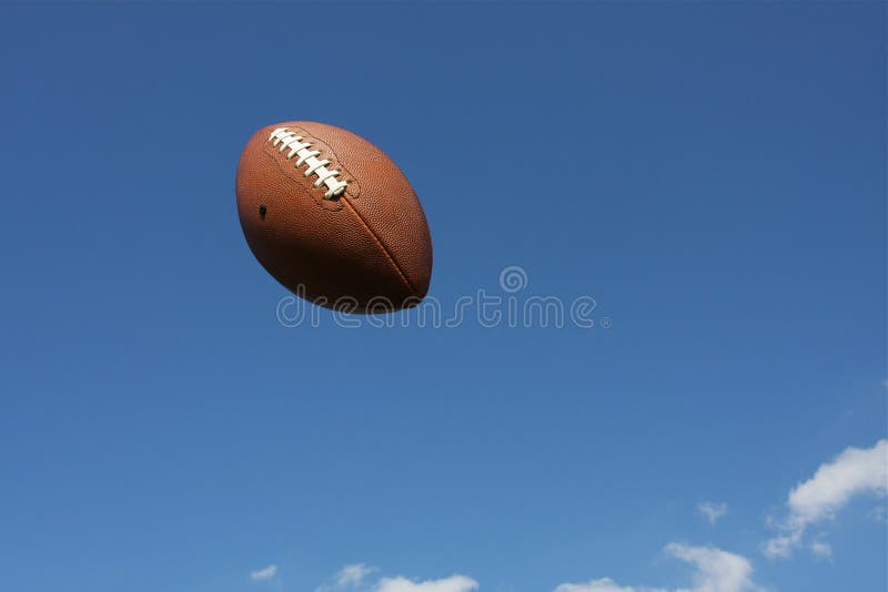 Spiraling Football in the Sky Stock Image - Image of pigskin, athletics ...