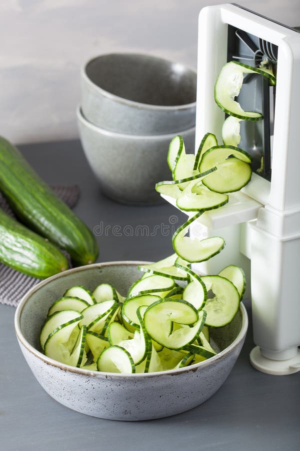 Spiralizing Cucumber Vegetable with Spiralizer Stock Image - Image of ...
