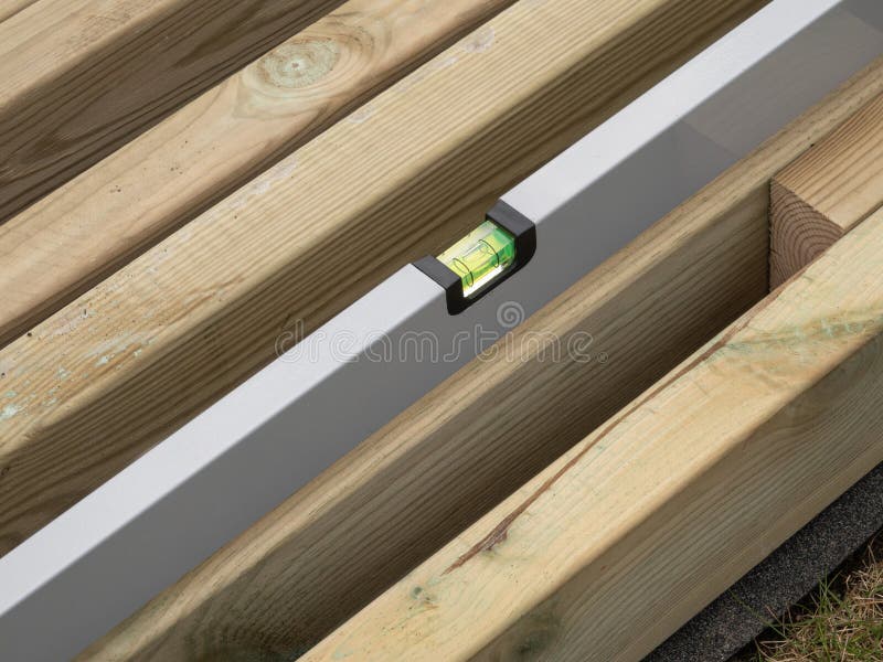 Spirit Level or Construction Water Level Checking the Level of a Plank ...