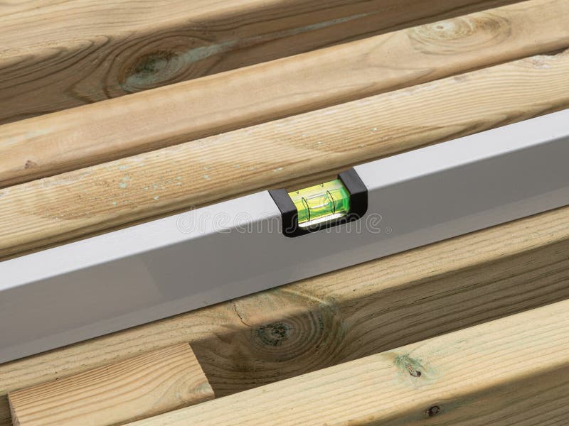 Spirit Level or Construction Water Level Checking the Level of a Plank ...