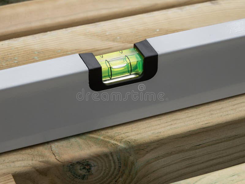 Spirit Level or Construction Water Level Checking the Level of a Plank ...