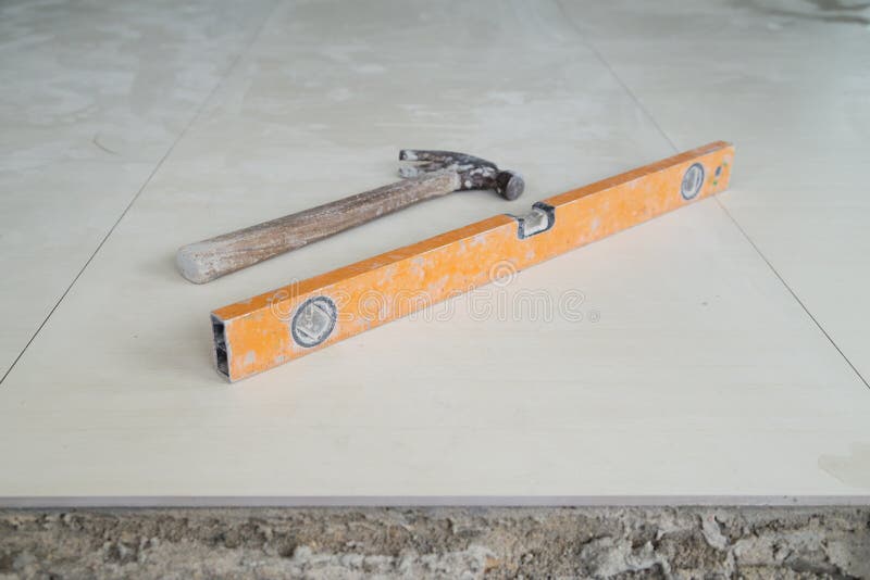 Spirit Level and Hammer (tool for Working Tile) Stock Photo - Image of ...