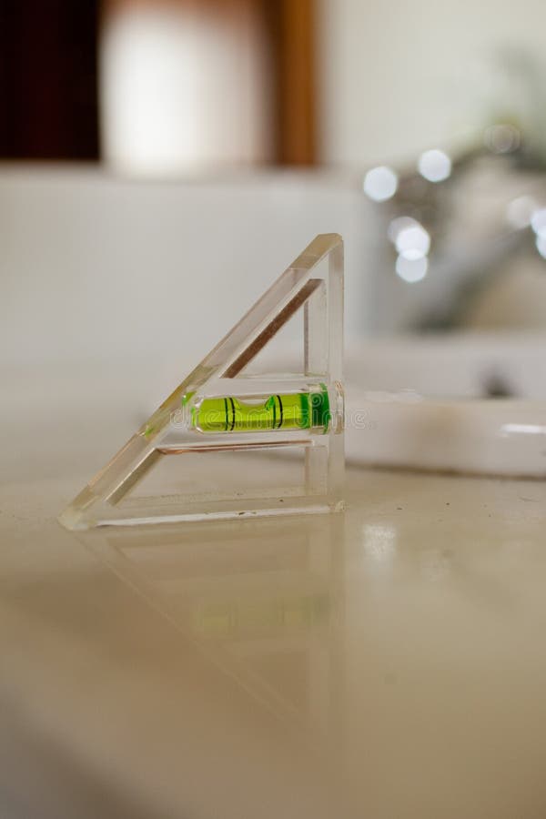 Spirit Level Tool in Bathroom Background. Close Up View of Construction ...