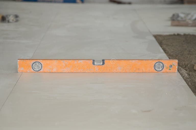 Spirit Level Tool on Floor Tile Stock Image - Image of cross ...