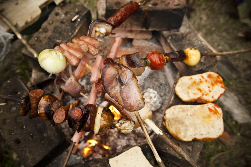 Spit cooking on the grill. stock image. Image of grill - 23976213