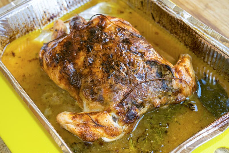 Spit roast chicken stock photo. Image of container, spit - 107657174