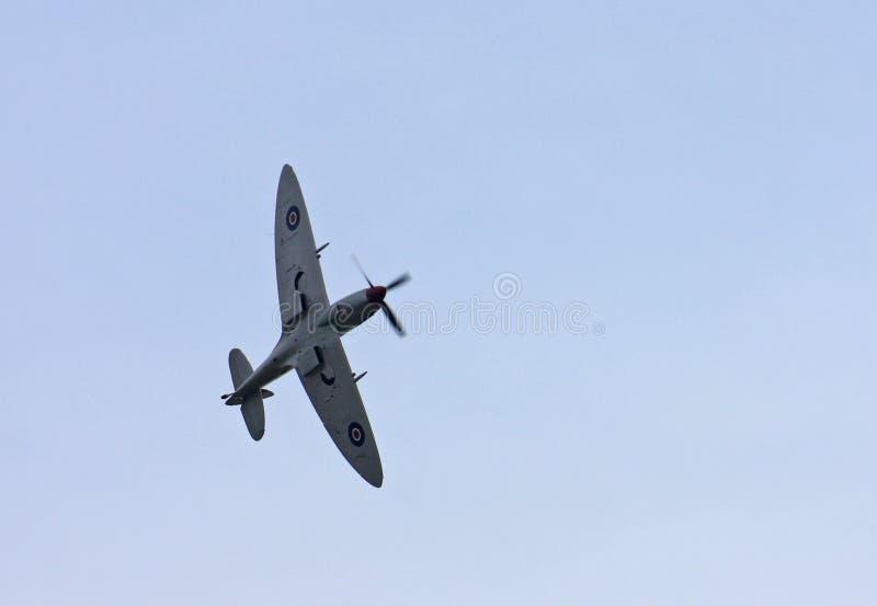 4 Military Spitfire Fighters Silhouettes in Blue Sky with White Clouds ...