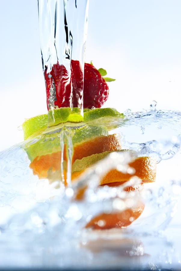 Fruits splashed into water stock photo. Image of slice - 38918588