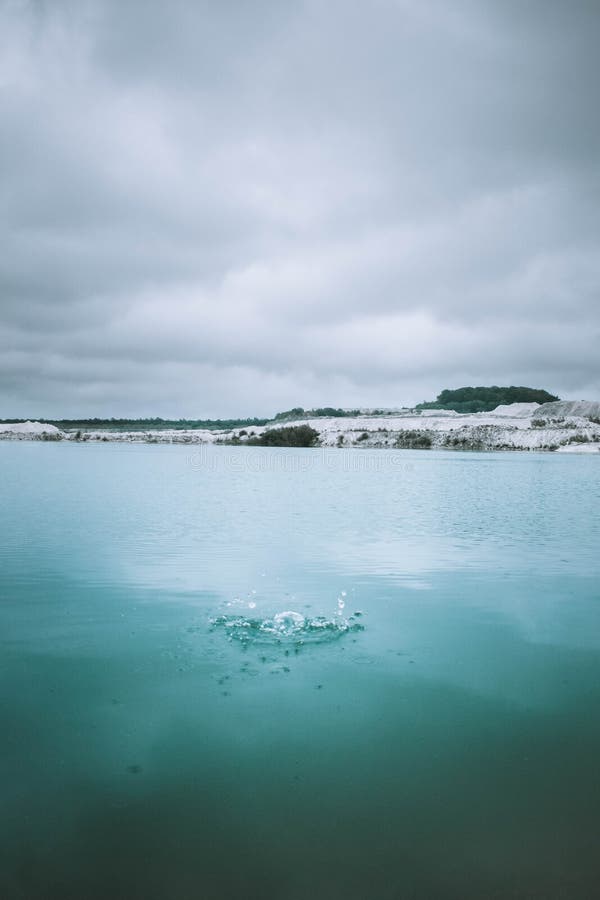 Splash on blue lake stock photo. Image of lake, horizon - 205487120