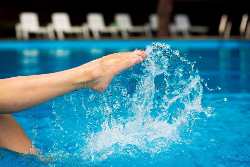 Splash in the pool stock photo. Image of foot, blue - 100330082