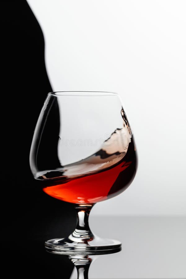 Splash of Brandy in a Snifter Glass Stock Photo - Image of beverage ...
