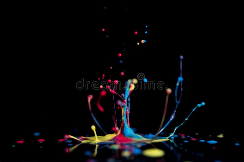 Splash of Colorful Liquid Paint on a Black Background Paint Splash on ...