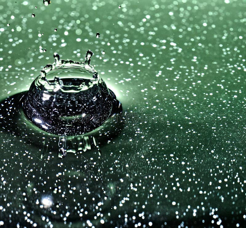 Splash - a Drop of Water Falling into the Water in a Macro Shot Stock ...