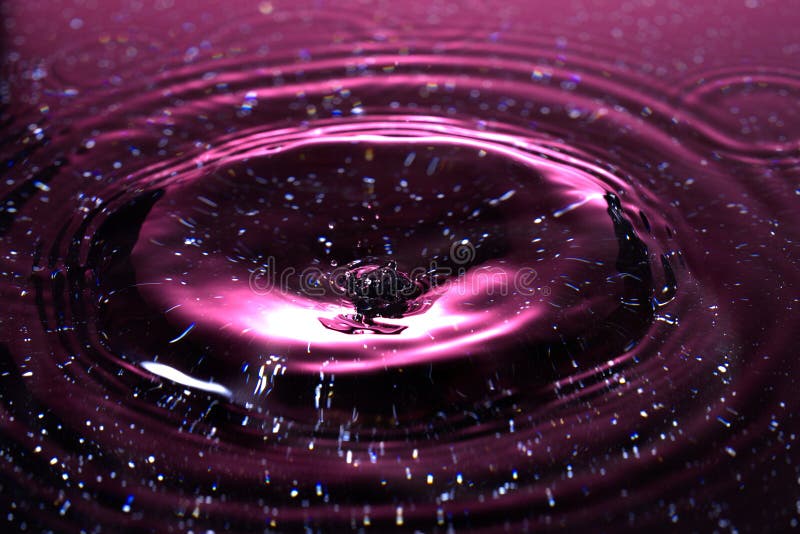 Splash - a Drop of Water Falling into the Water in a Macro Shot Stock ...