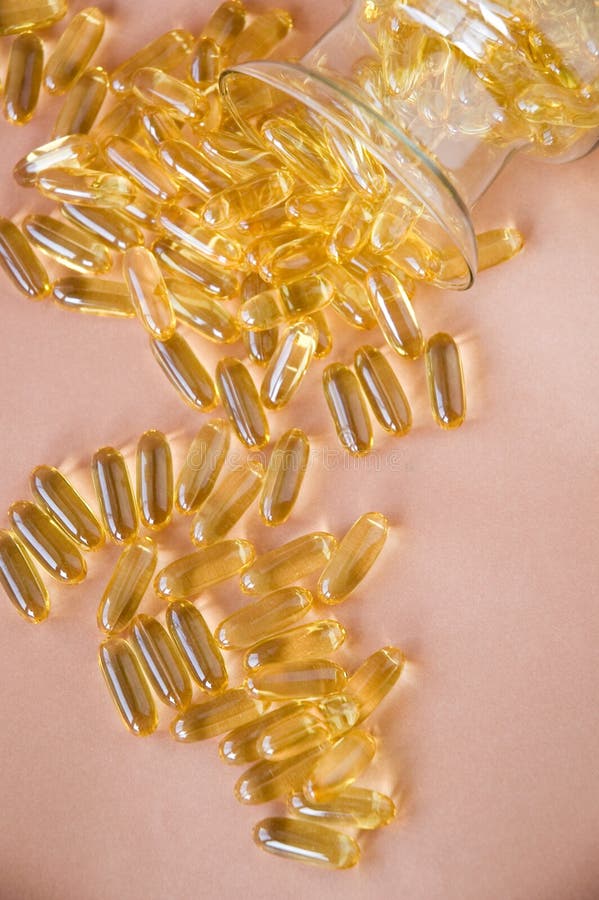 Splash of Fish Oil Capsules Stock Image - Image of bottle, glass: 39935535