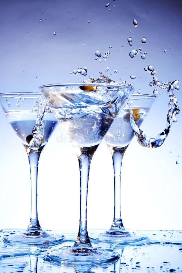 Splash martini on blue stock photo. Image of black, palmetto - 5648714