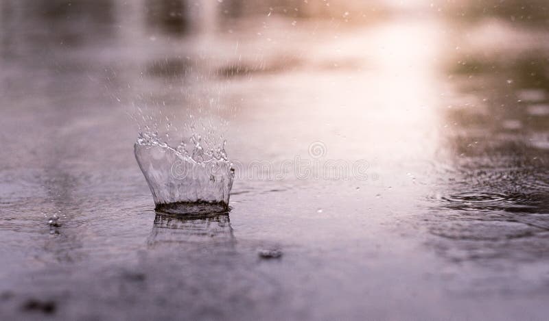 Splash of Rain Drop on Surface of Water, when it is Raining Stock Photo ...