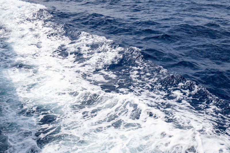 Splash of Ship Water Trails Cutting through Calm Sea Stock Photo ...