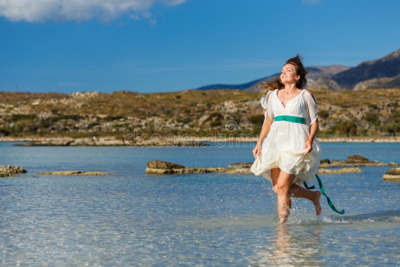 Splash of Water and Beautiful Girl Running. Stock Photo - Image of ...