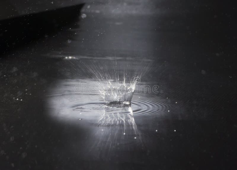 Splash of Water on Dark Background. Rainy Stock Photo - Image of puddle ...