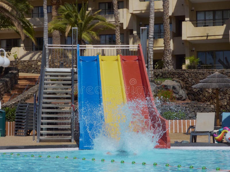 Splash in the Water from Falling into a Pool Going Down a Slide in the ...