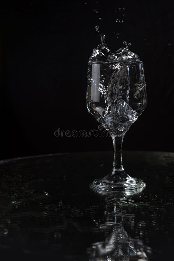 A Splash with Water and Ice on a Black Background Stock Photo - Image ...
