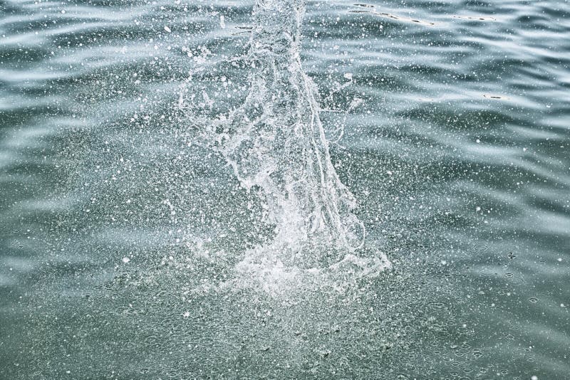 Splash of Water with Splashes and Drops on the Sea Surface Stock Image ...