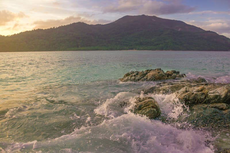 Splash waves hit rocks stock photo. Image of sand, nature - 98157494