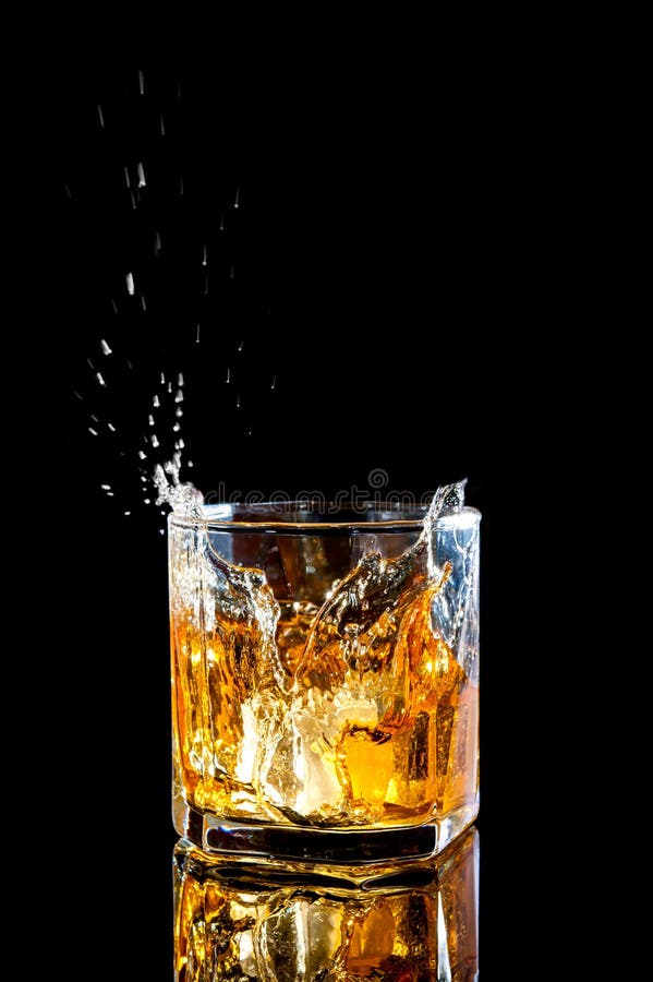 Splash of whiskey stock photo. Image of motion, splash - 62448450