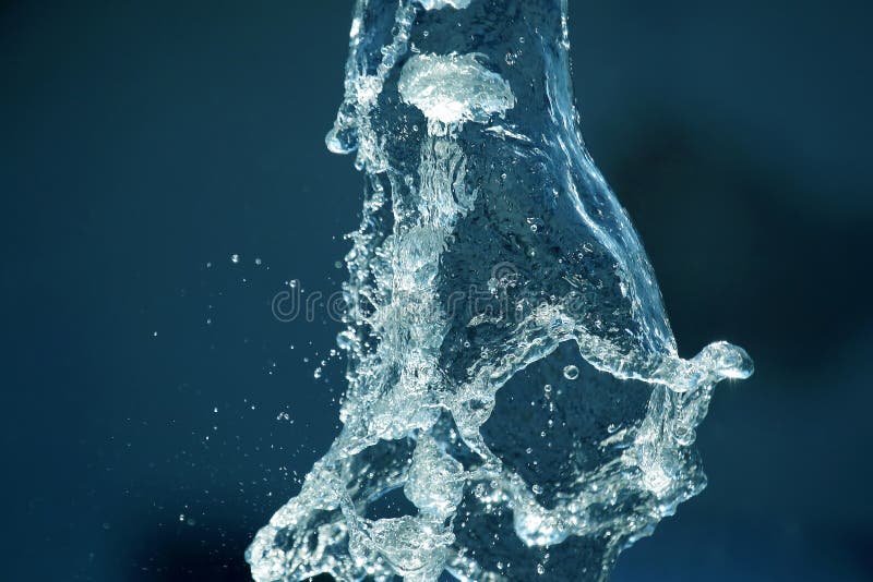 Splashes of Flying Water from the Fountain Against the Blue Sky Stock ...