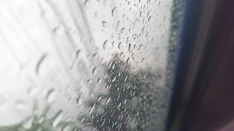 Splashes of Rainwater Sticking To a Car Window during the Rainy Day ...