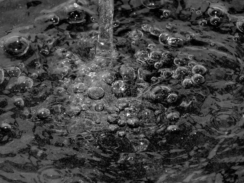 Splashes of Water with a Splash on a Black and White Image Stock Photo ...