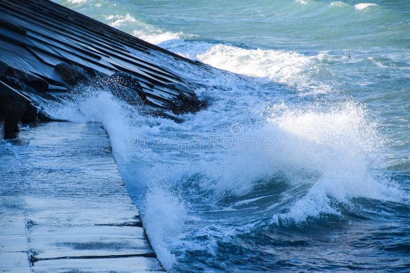 Splashes of Waves on the Concrete Beachfront Promenade. Stone Steps To ...