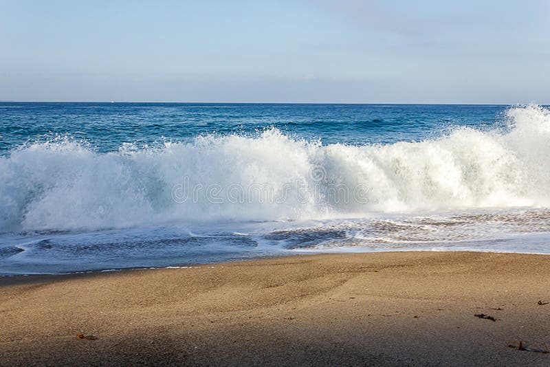 Splashing Breaking Foaming Wave on Sandy Beach with Backwash Stock ...