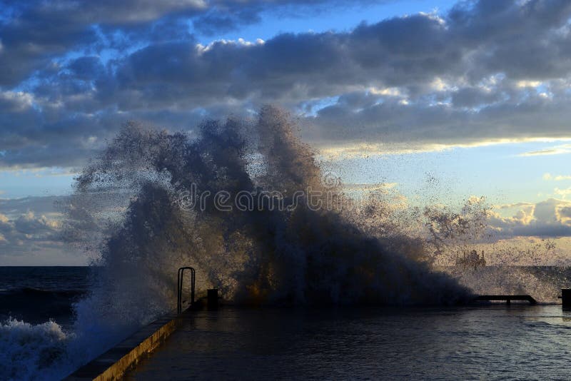 Splashing through a Breakwater from a Wave during a Storm Stock Image ...