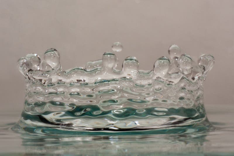 Splashing a drop of water. stock photo. Image of frozen - 254793198