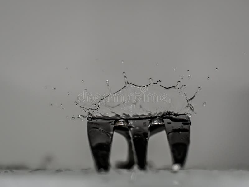 Splashing a Drop of Water on a Fork Stock Image - Image of pure, flow ...