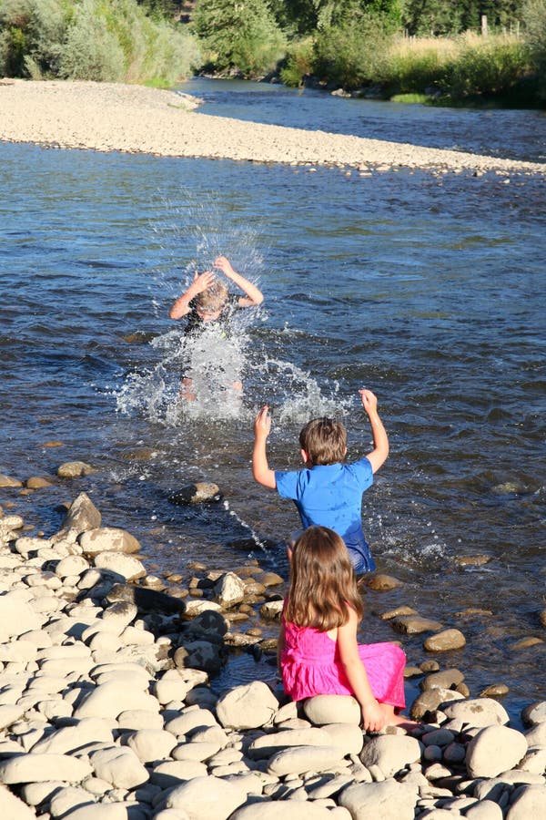Splashing kids stock photo. Image of rocks, action, recreation - 46476138