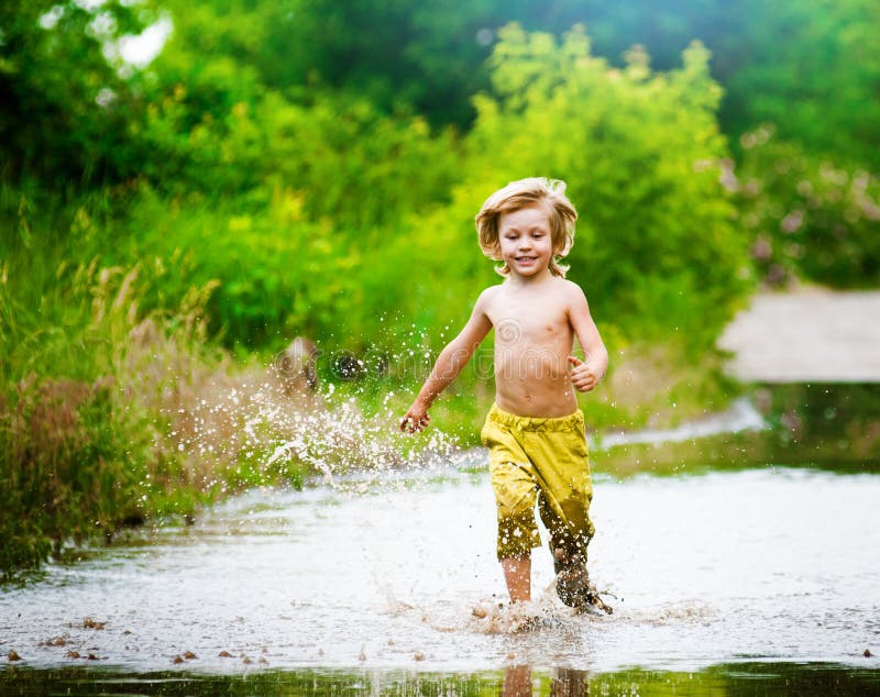 Splashing in a puddle stock photo. Image of reflection - 41625176