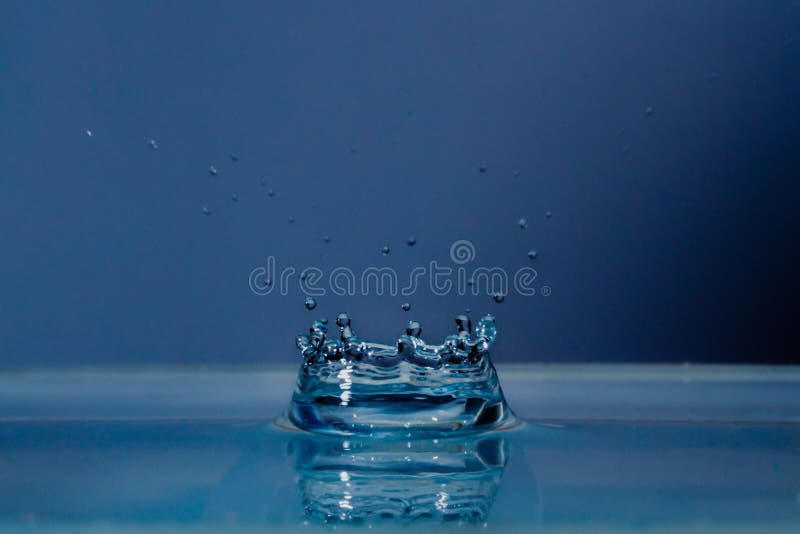 Splashing Water Drop Hitting Water Surface. Stock Photo - Image of ...