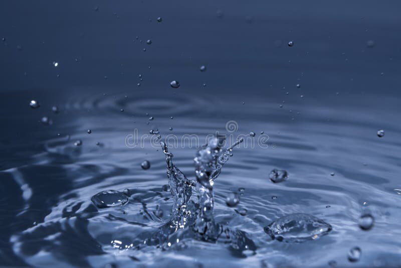 Splashing water drops stock photo. Image of background - 189250384