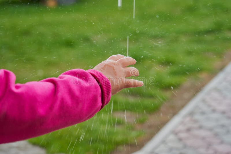 Splashing Water Falling on a Hand,a Child`s Hand Has Placed Its Hand ...