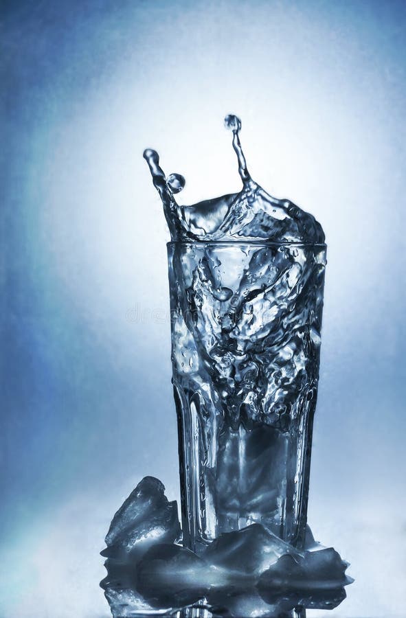 Splashing Water of Ice in a Cool Glass of Water Stock Image - Image of ...