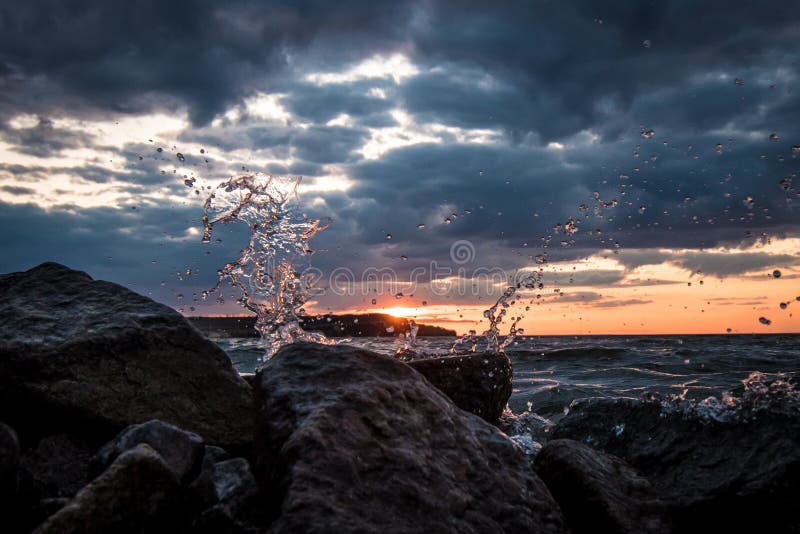 Splashing Water on the Sunset Background Stock Image - Image of water ...