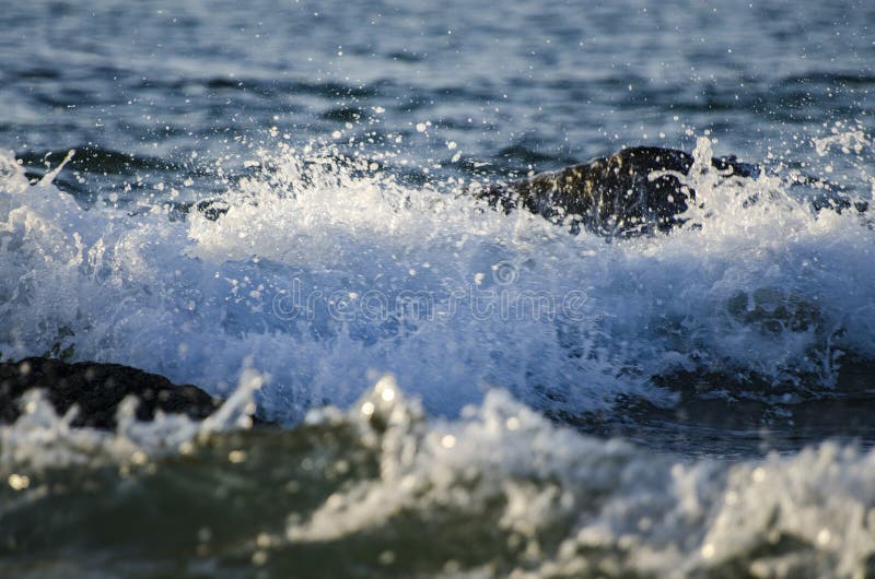 Splashing Wave while Hitting the Rock at the Beach Stock Photo - Image ...