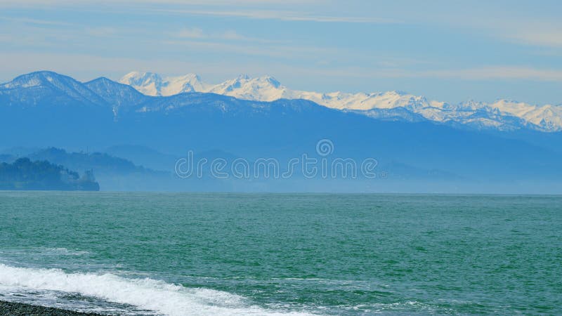 A Splashing Wave on a Stone Shore on a Mountain Lake on a Day. Pebbles ...