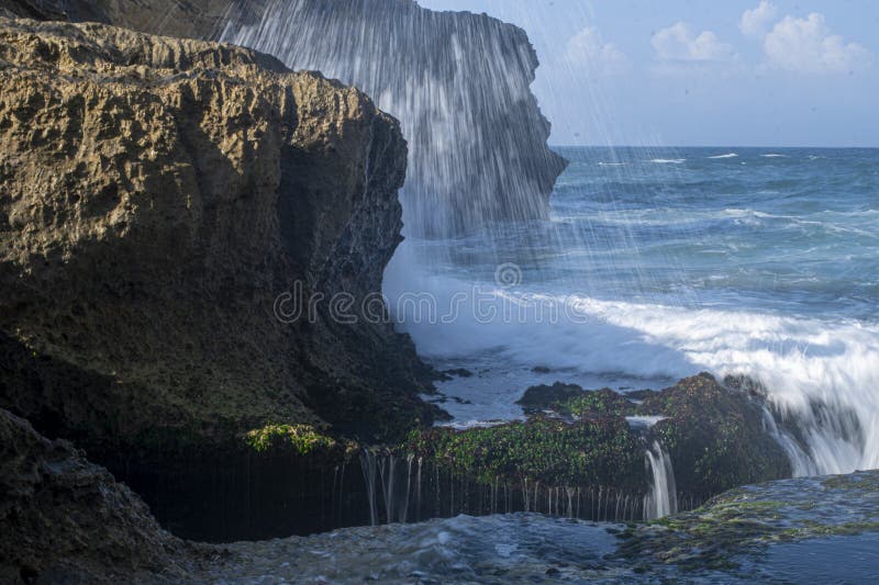 Splashing Waves Hitting the Rocks and Cliffs on the Beach. Stock Photo ...