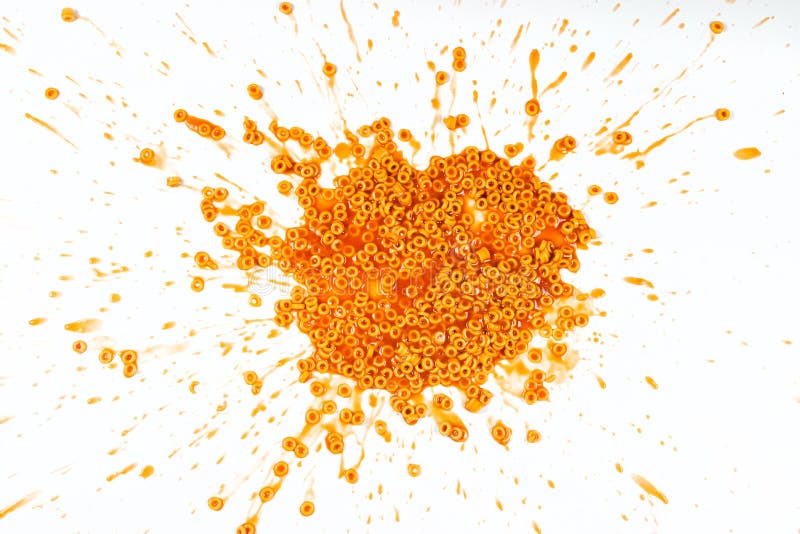 Splattered Spaghetti Rings in Tomato Sauce Stock Photo - Image of ...
