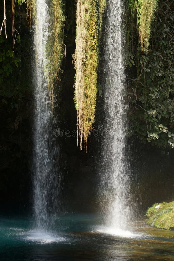 The Splendor of a Waterfall, Enhanced by the Golden Reflections of the ...