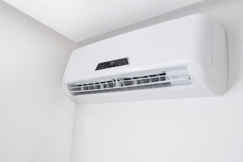 Split Air Conditioner on a White Wall in Flat Indoors Stock Photo ...